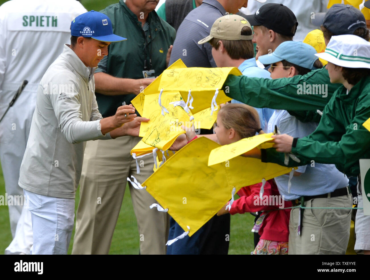 Ricky Fowler signs autographs during the Par Three Contest at the 2016 ...