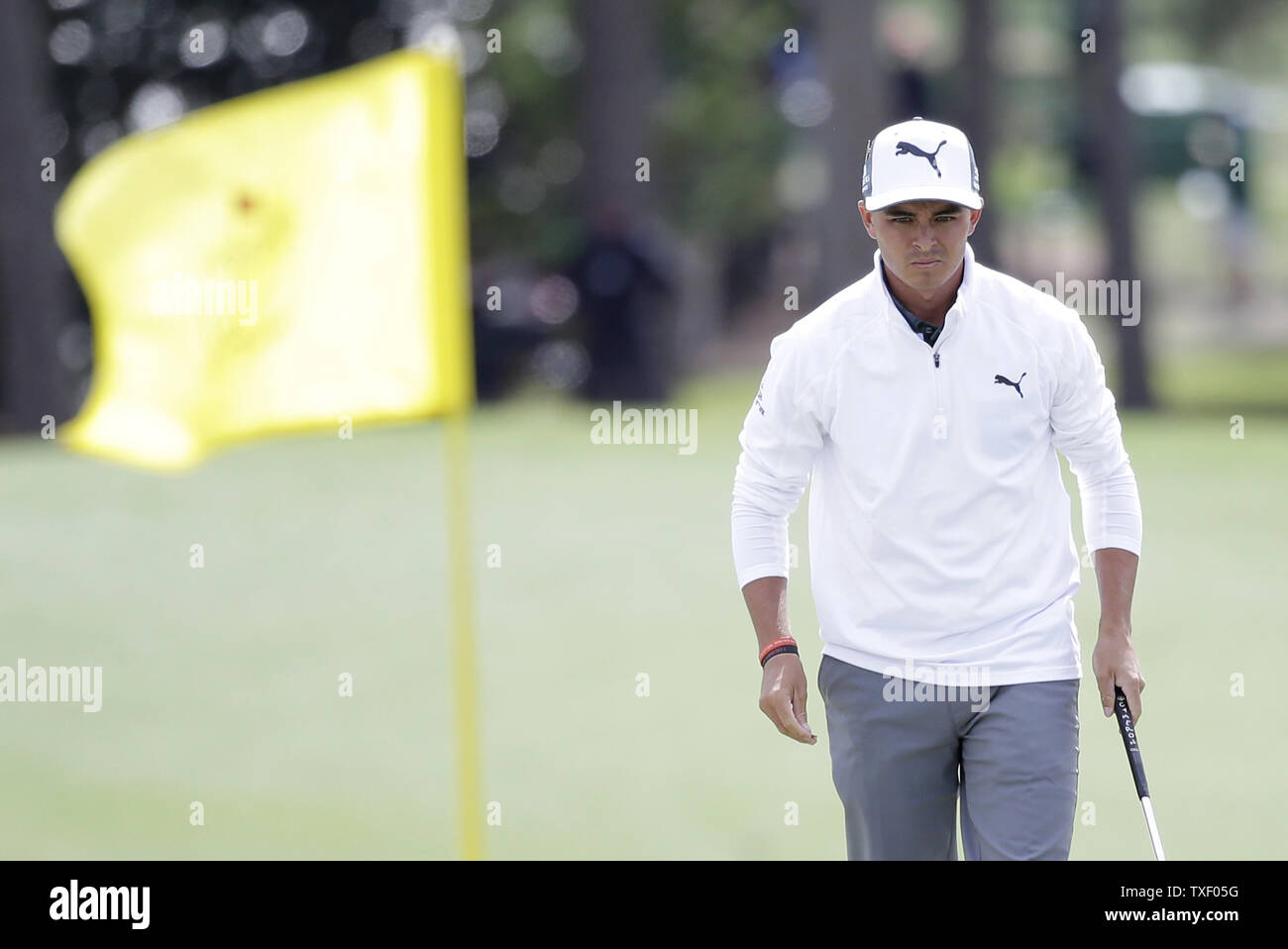 Rickie Fowler walks on the 18th green in the first round at the 2017 ...