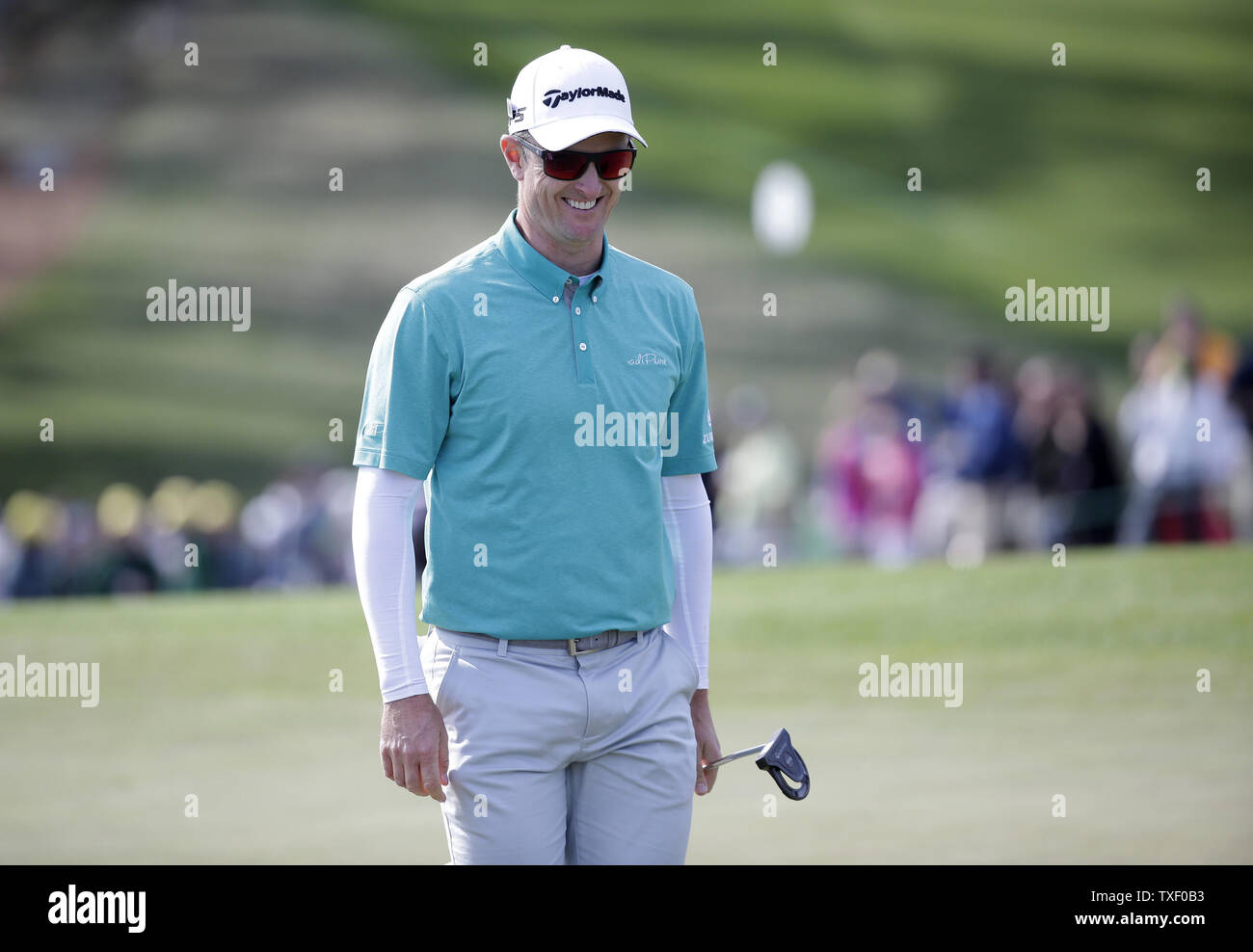 Justin Rose of England smiles own the 9th green in the second round at ...