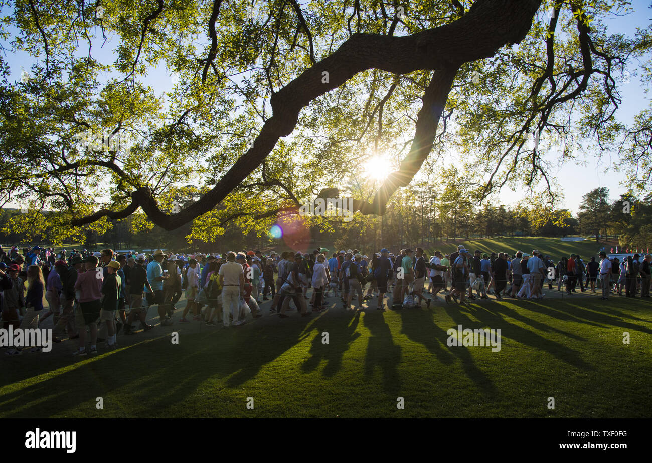Patrons leave the grounds after the third round of the 2017 Masters ...