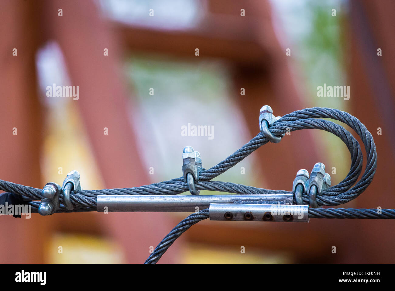 Steel ropes connected by loose straps with blur background Stock Photo ...