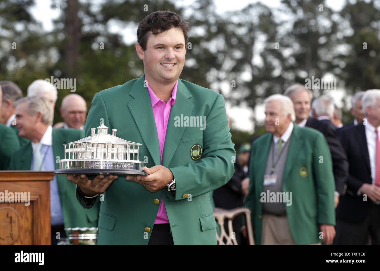 Patrick Reed wears his Green Jacket and holds the Masters Trophy after ...
