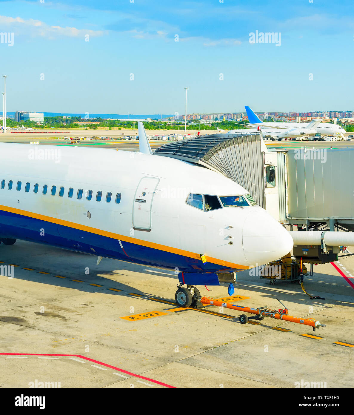 Airplane with gangway at airport runway in sunshine Stock Photo - Alamy