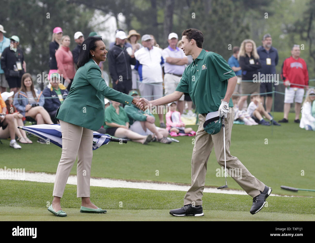 Nathan Drogin shakes hands with Former United States Secretary of State ...