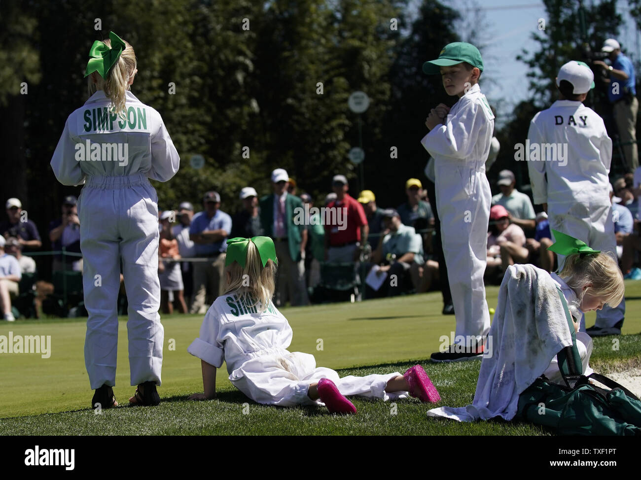 Daughters of Webb Simpson play on the green at the Par 3 Contest on the ...