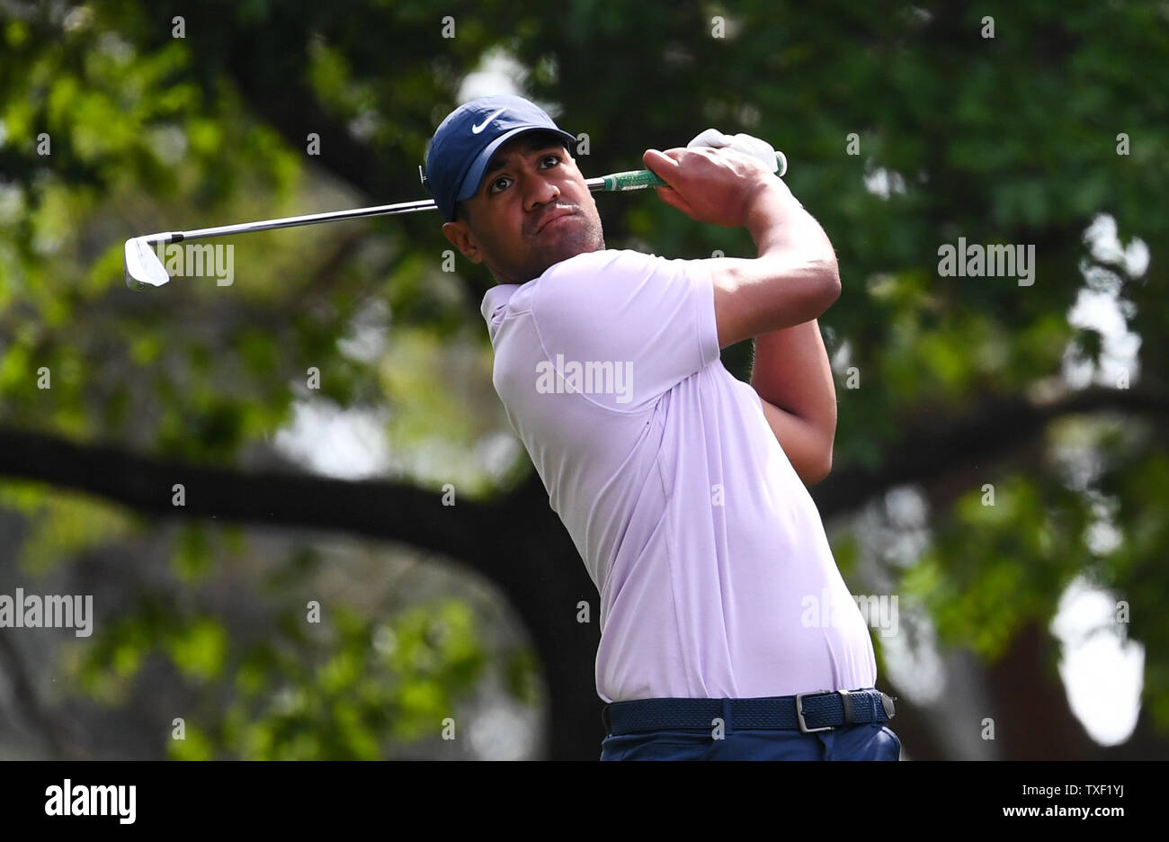 Tony Finau watches his shot from the fourth tee during the first round ...