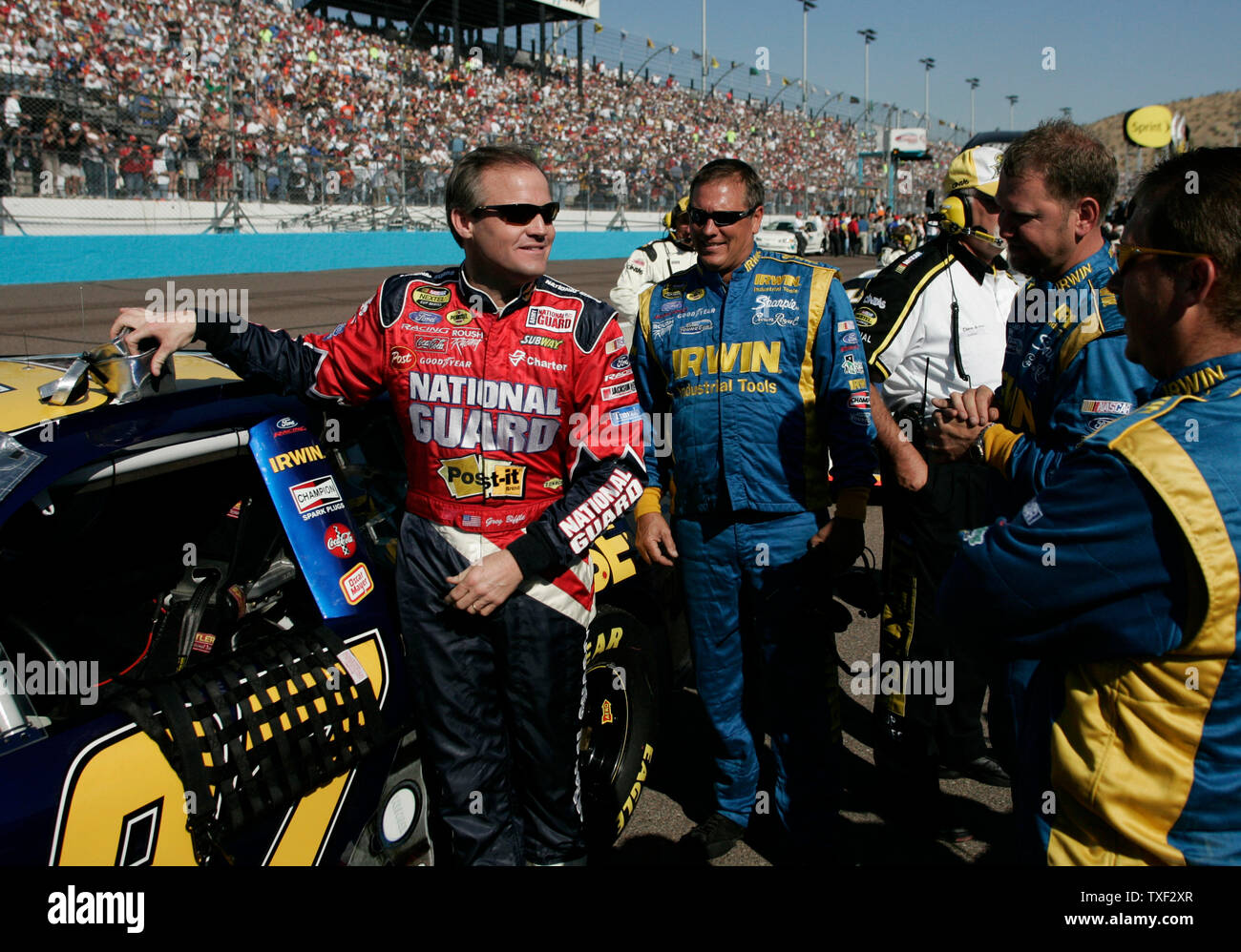 Kenny Wallace talks with the Roush Racing pit crew before the race ...