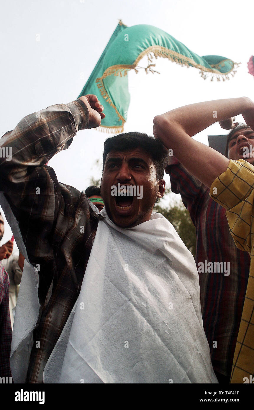 Iraqi Shi'ite Muslims protest near the Coalition Provisional Authority ...