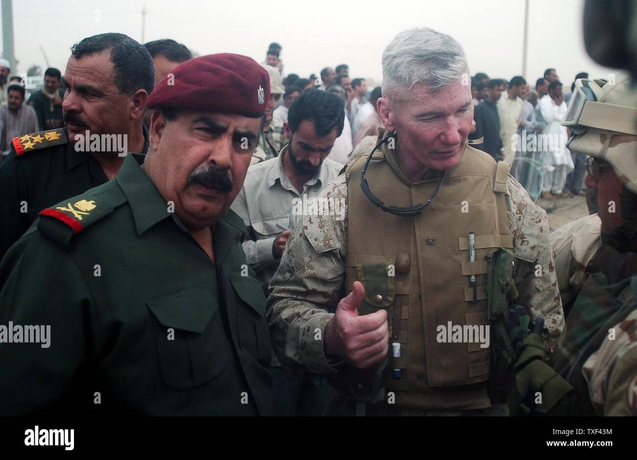 Yasin Mohamed Sali (L), a former general of Saddam Hussein's regime ...