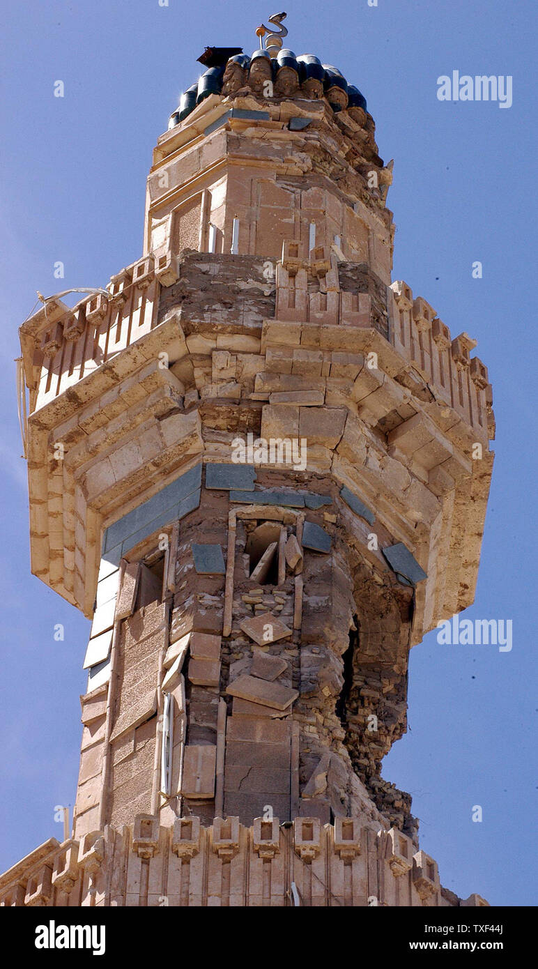 The minaret of Abu Aziz mosque shows the damage of the violence during ...