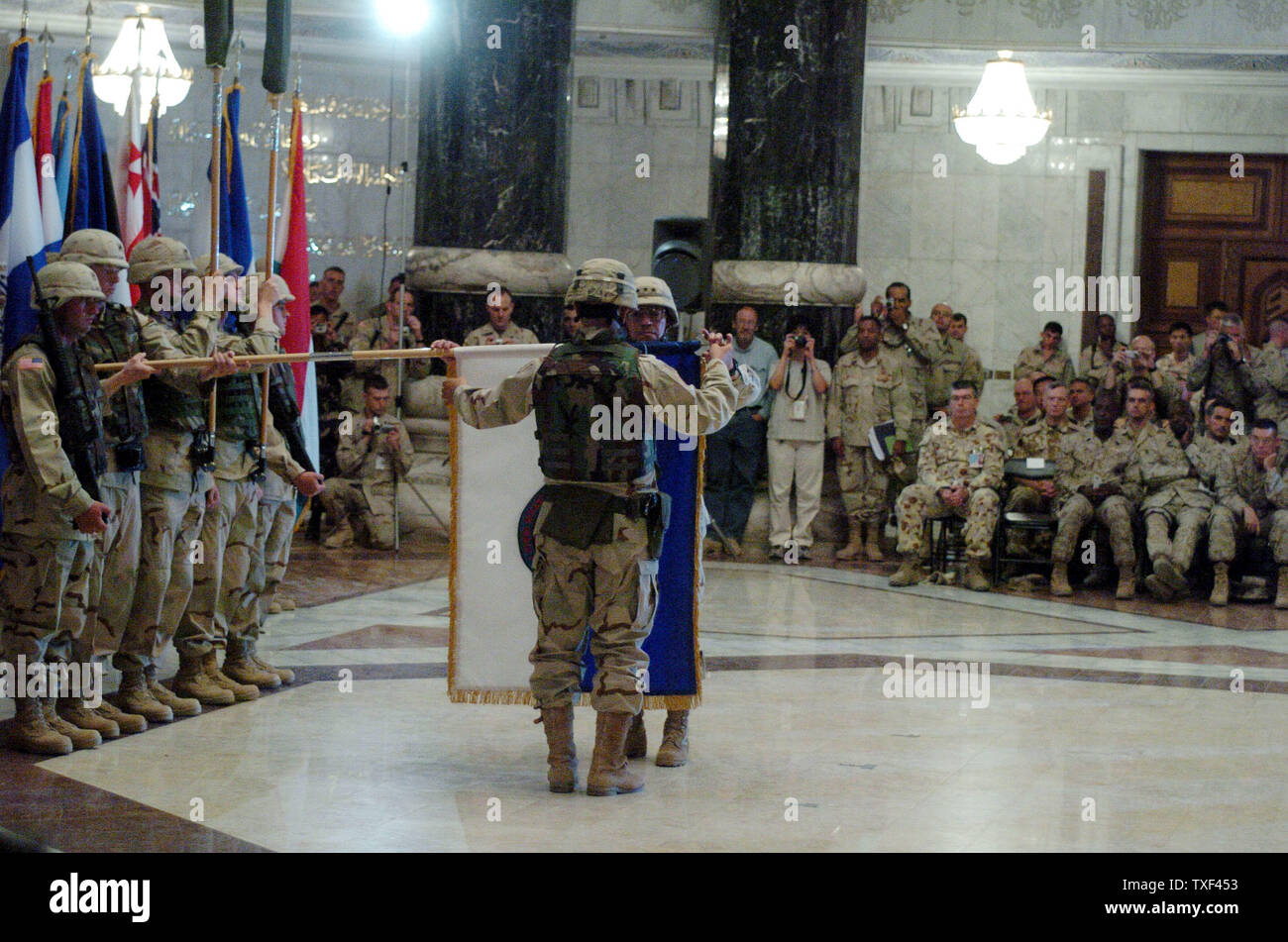 Flags of the coalition troops present honors to the new Multi-National ...