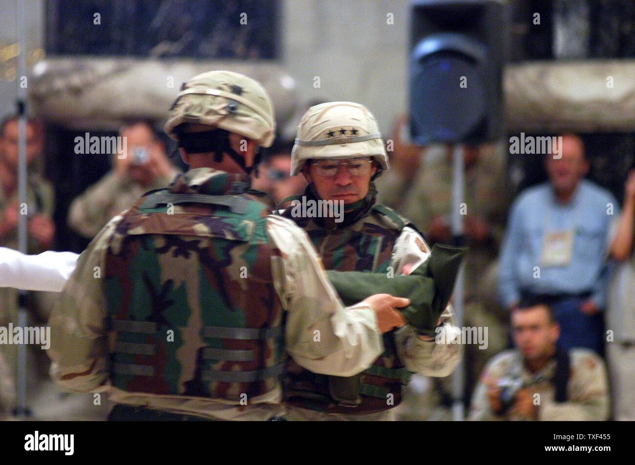 LTG Ricardo Sanchez pull out the new Multi-National Force-Iraq flag ...