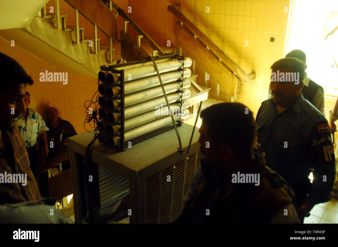 Iraqi police secure the rocket launcher used against Al Saddon Police ...