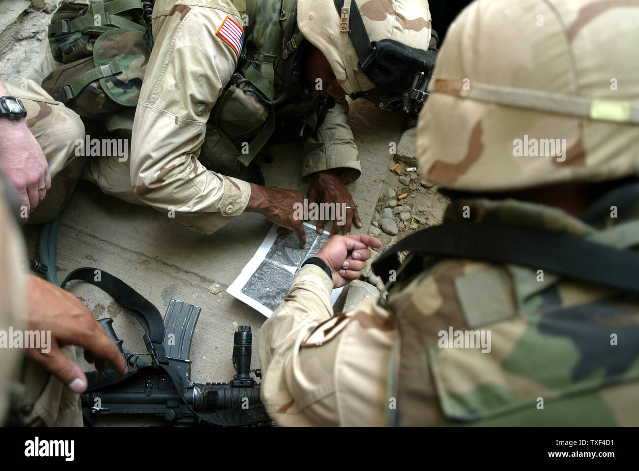 Officers and non-commissioned officers plan a mission to rescue an ...