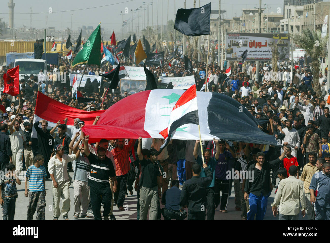 Iraqi Shiite Muslims take to the streets of Baghdad's Sadr City to ...