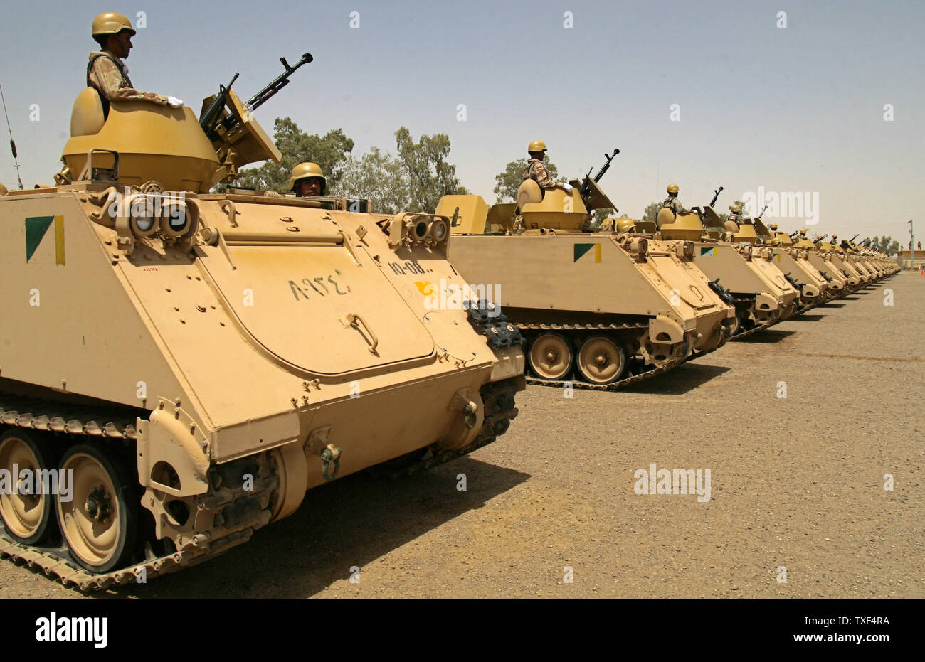 Iraqi soldiers in formation during their graduation ceremony at a ...
