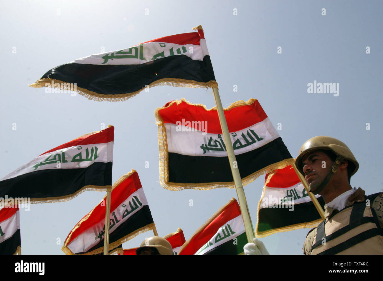 Iraqi soldiers in formation during their graduation ceremony at a ...