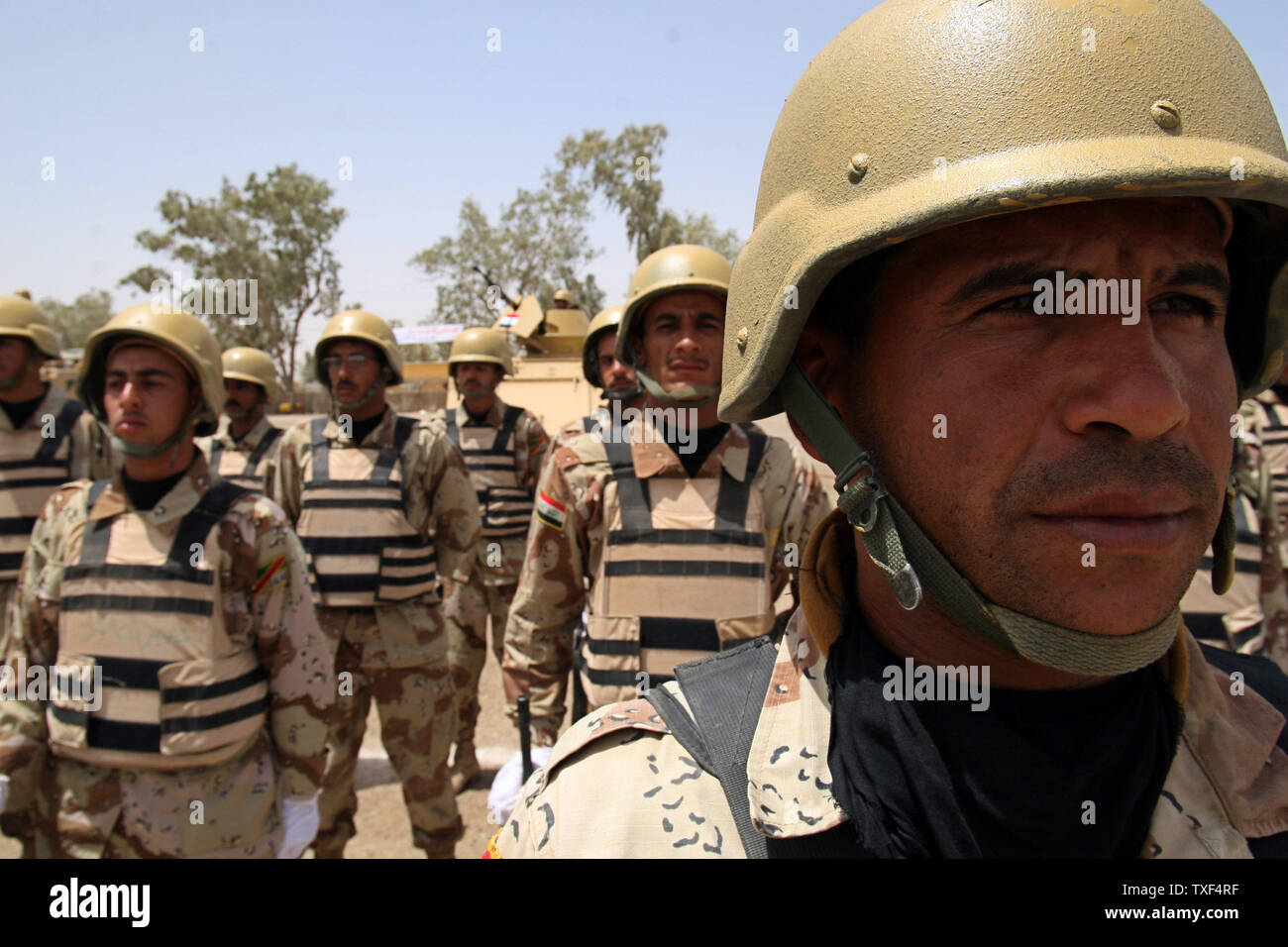 Iraqi soldiers in formation during their graduation ceremony at a ...