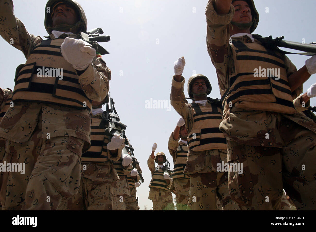 Iraqi soldiers in formation during their graduation ceremony at a ...