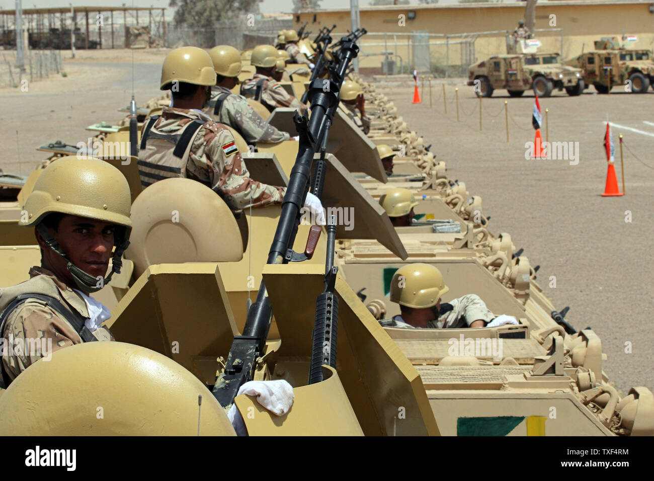 Iraqi soldiers in formation during their graduation ceremony at a ...