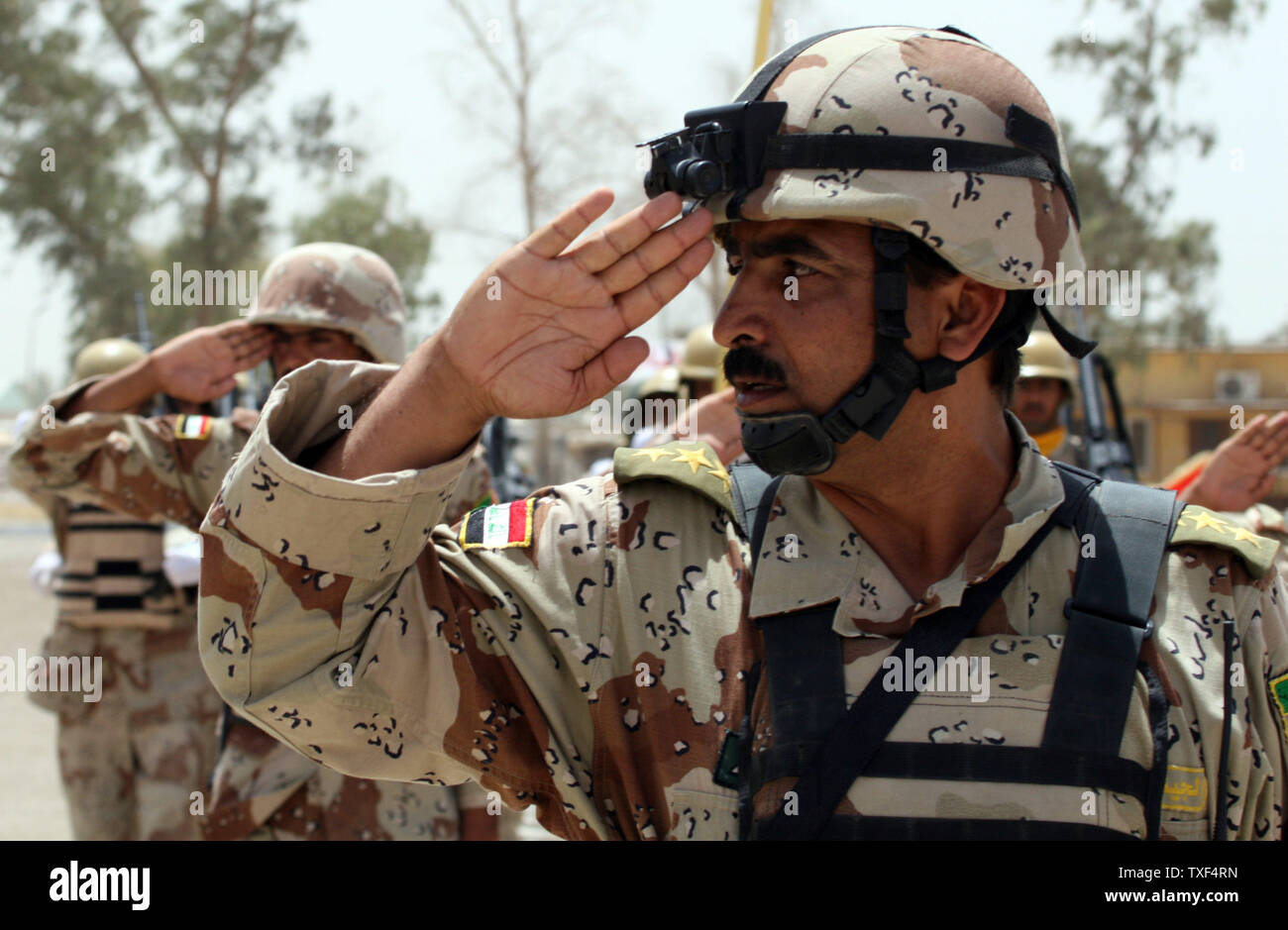 Iraqi soldiers in formation during their graduation ceremony at a ...