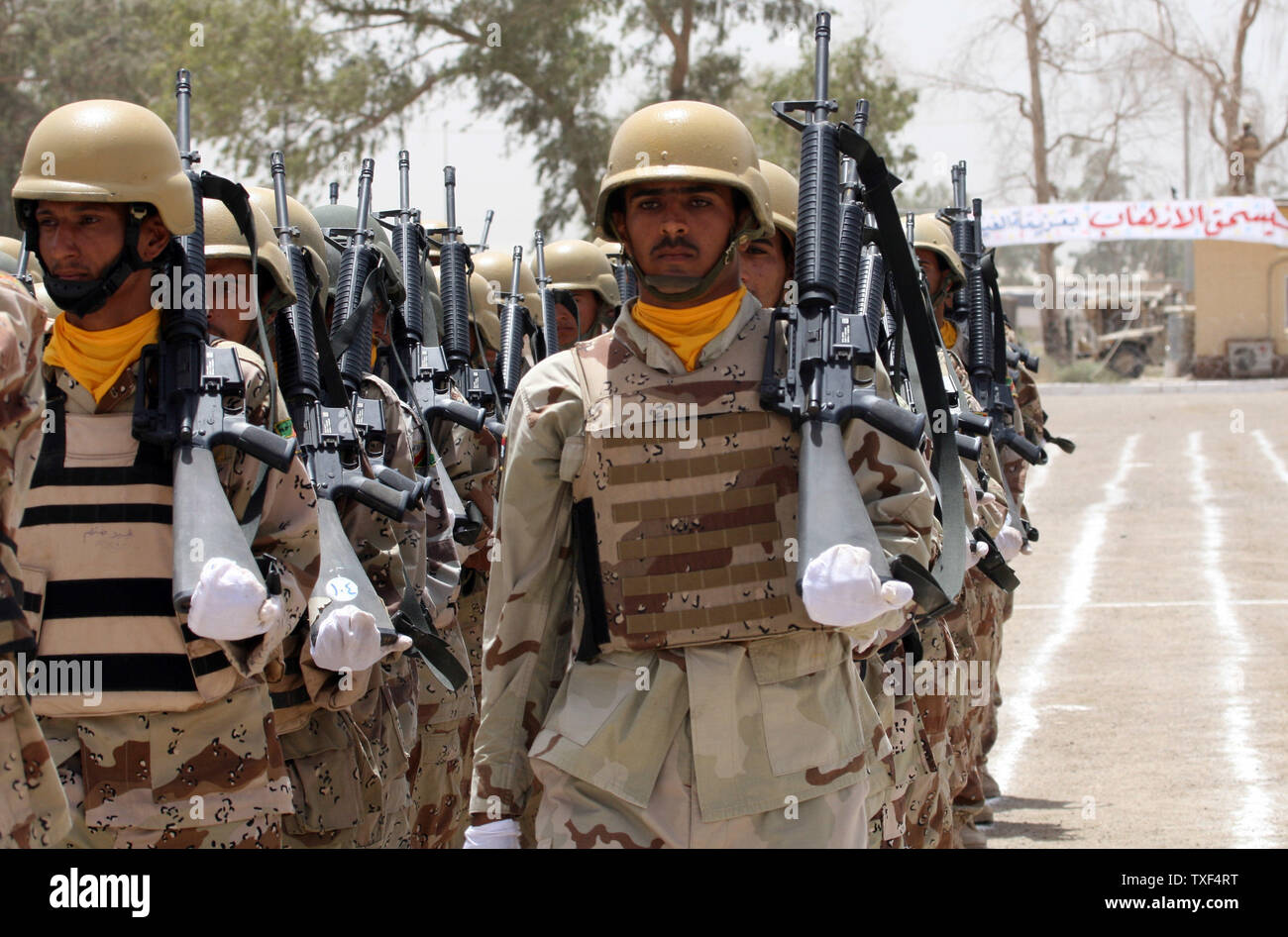 Iraqi soldiers in formation during their graduation ceremony at a ...