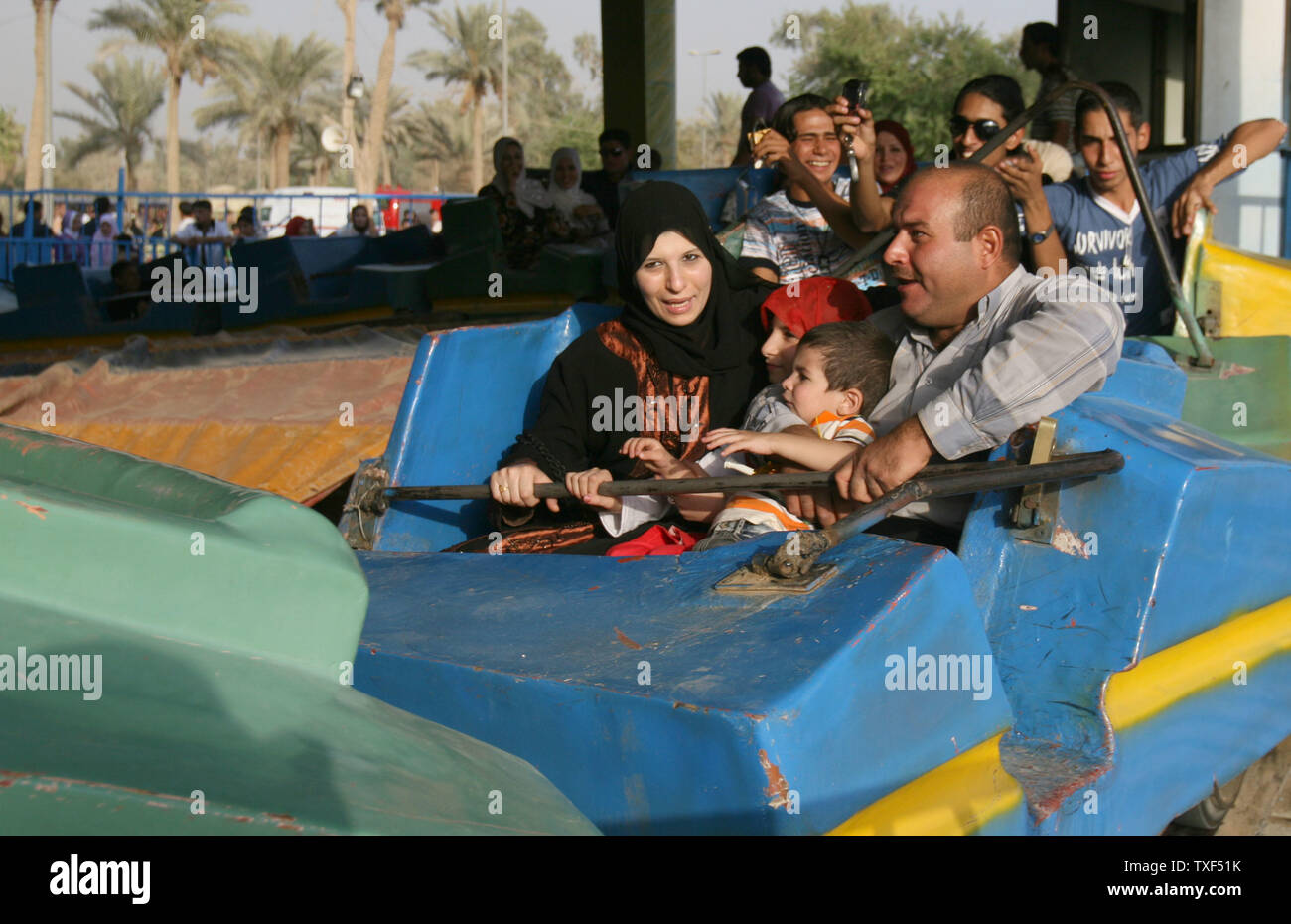 Iraqi Sunni Muslims visit Zawra park as they celebrate the first day of ...