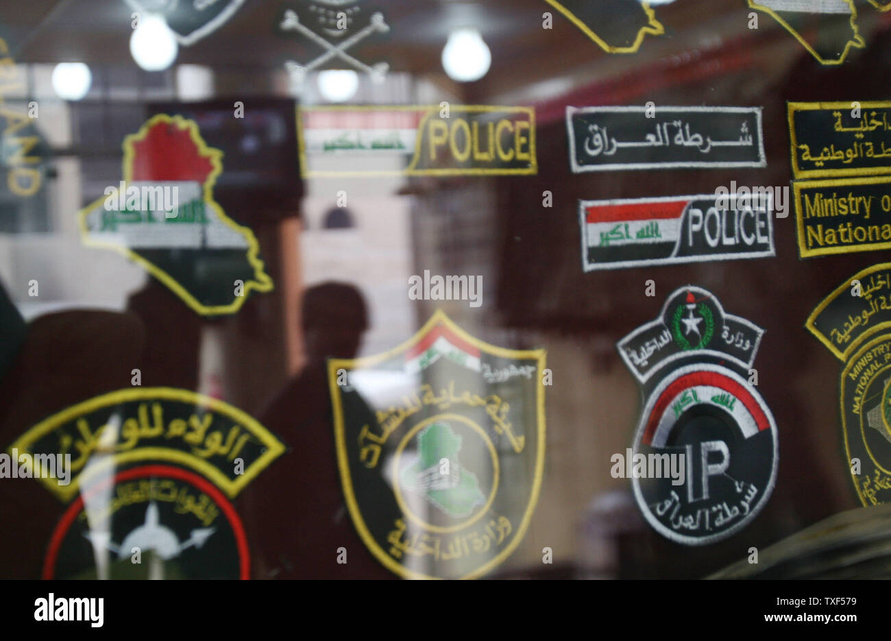 Iraqi army insignias are displayed at the shop of tailor Ahmad Radi ...