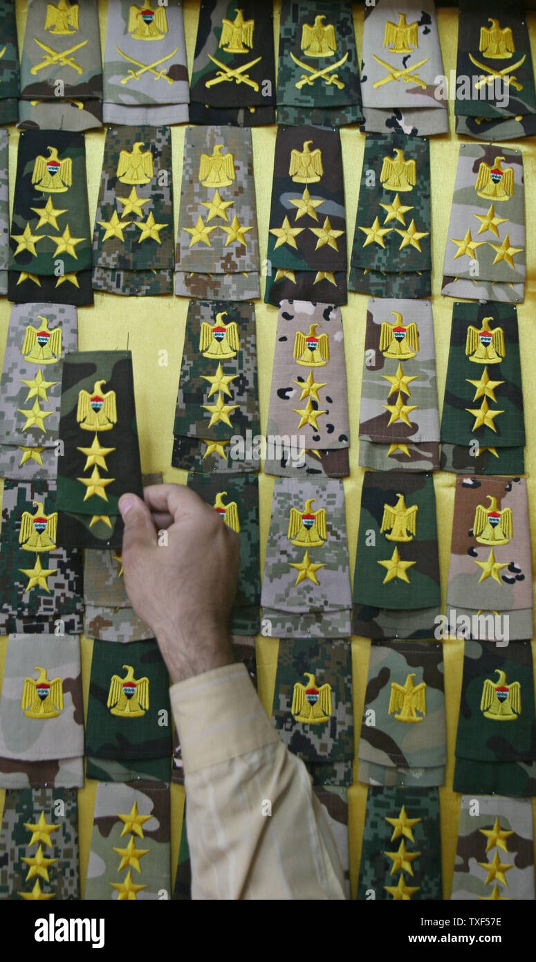 Iraqi army insignias are displayed at the shop of tailor Ahmad Radi ...