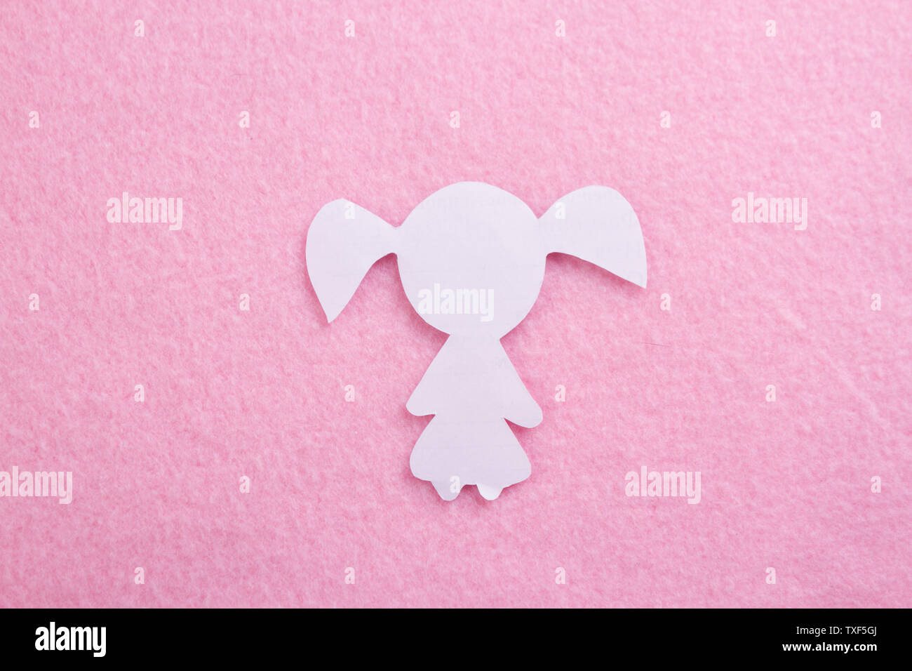 Young girl child paper art. pink background Stock Photo - Alamy