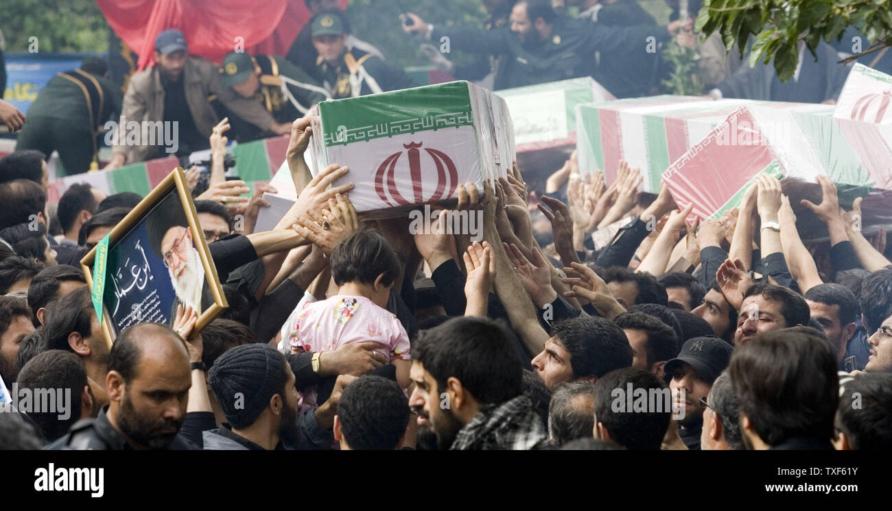 Iranian men commemorate those who were killed during Iran-Iraq war ...