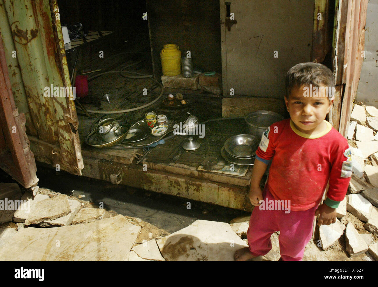 A young boy, whose family is squatting near a major American military ...