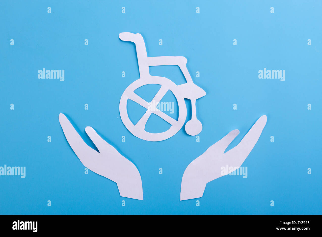 wheelchair on blue background made of paper Stock Photo - Alamy