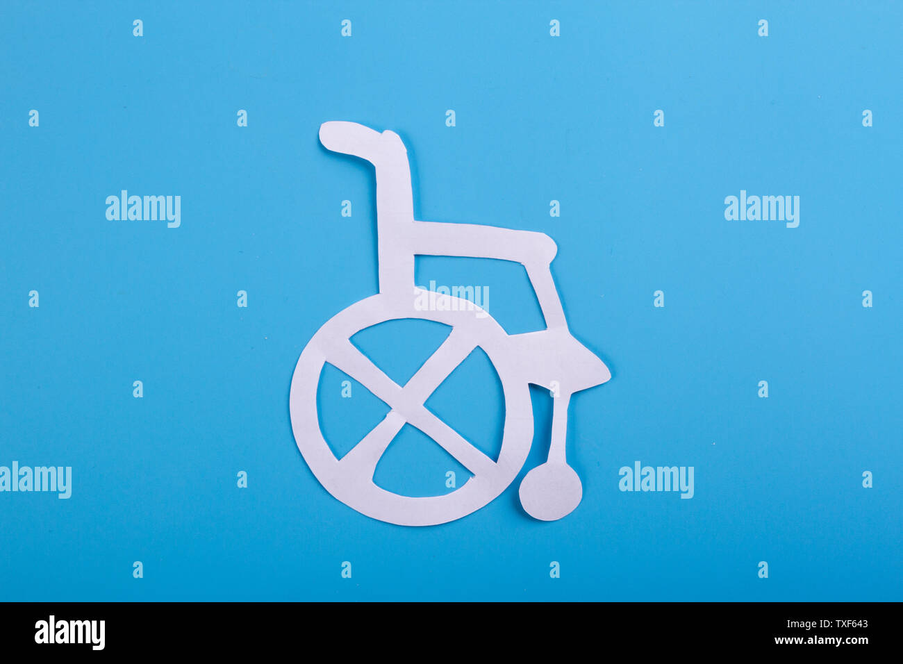 wheelchair on blue background made of paper Stock Photo - Alamy
