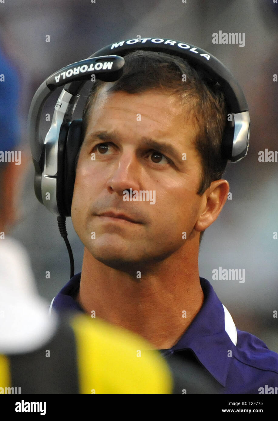 Baltimore Ravens' head coach John Harbaugh leads his team against the ...