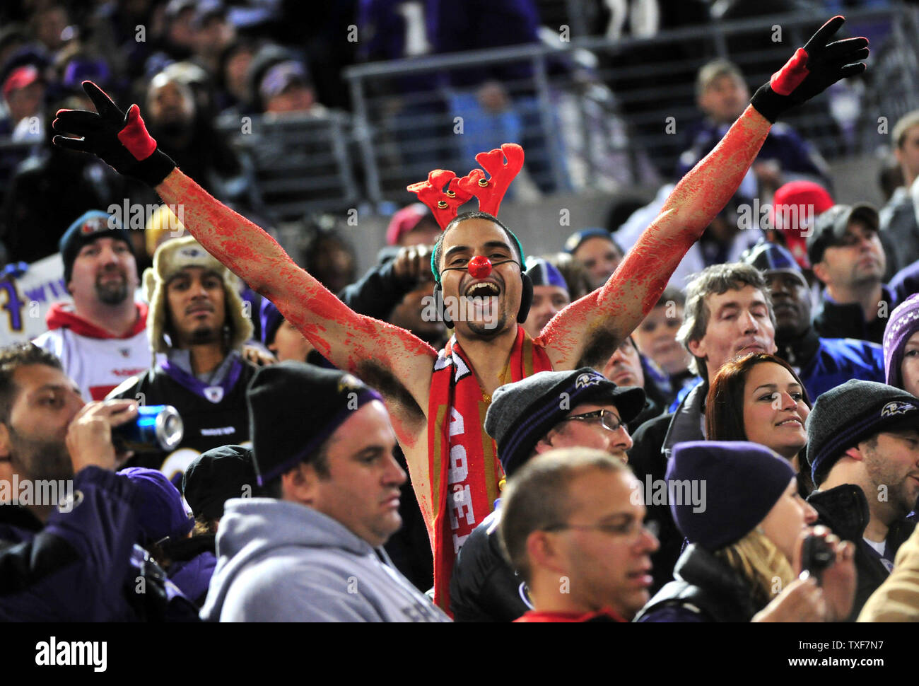 A Baltimore Ravens fan cheers as the Ravens play the San Francisco ...
