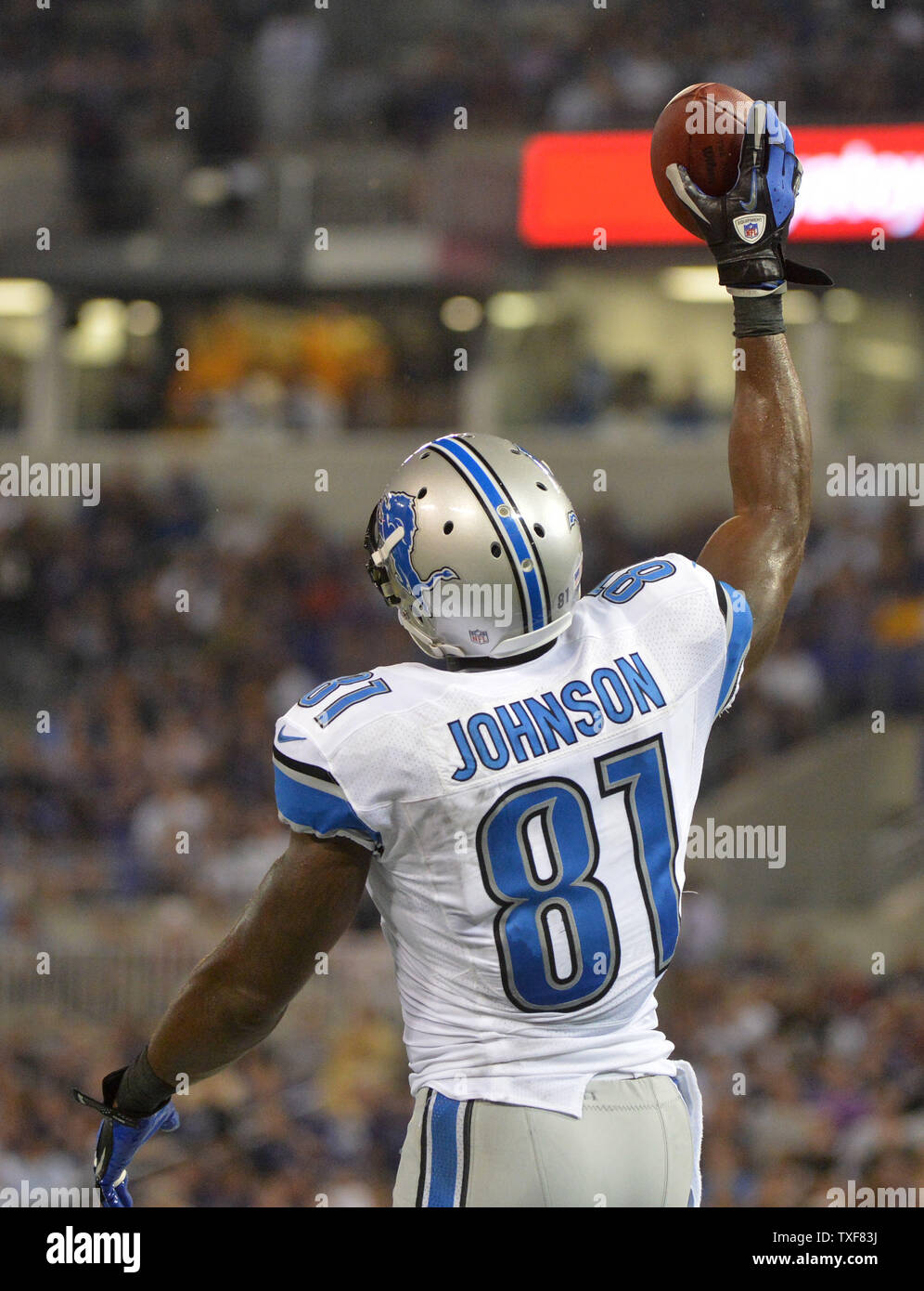 Detroit Lions wide receiver Calvin Johnson celebrates after bringing in ...