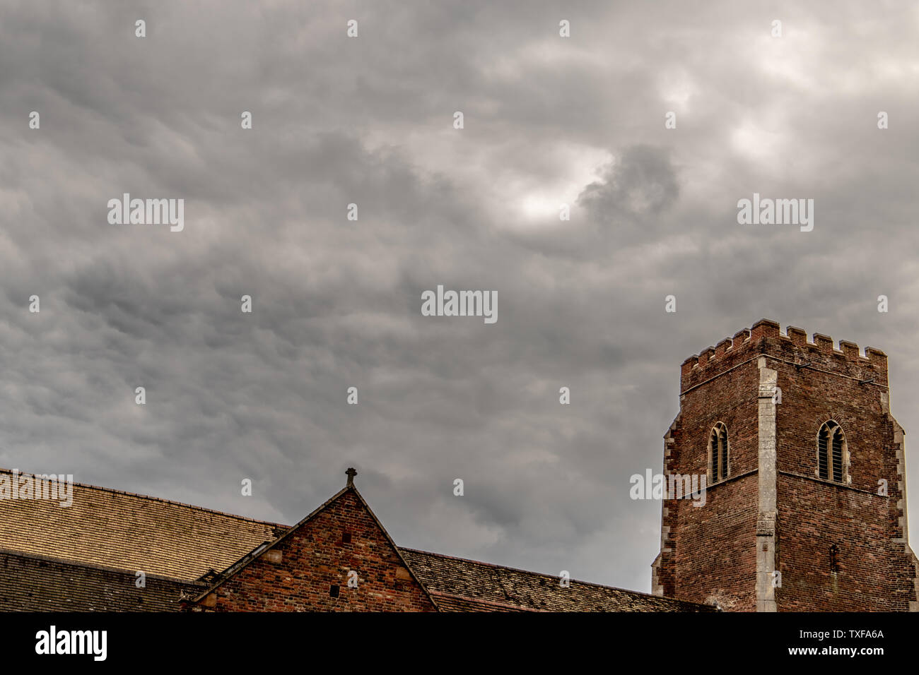 Cloudy sky over church hi-res stock photography and images - Alamy