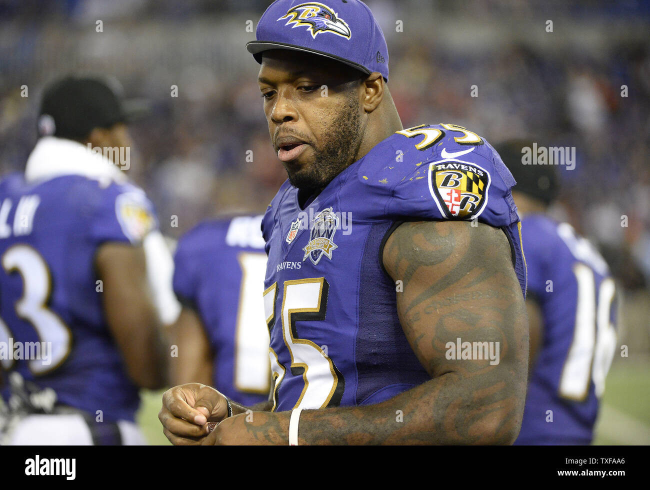 Baltimore Ravens outside linebacker Terrell Suggs (55) walks the ...