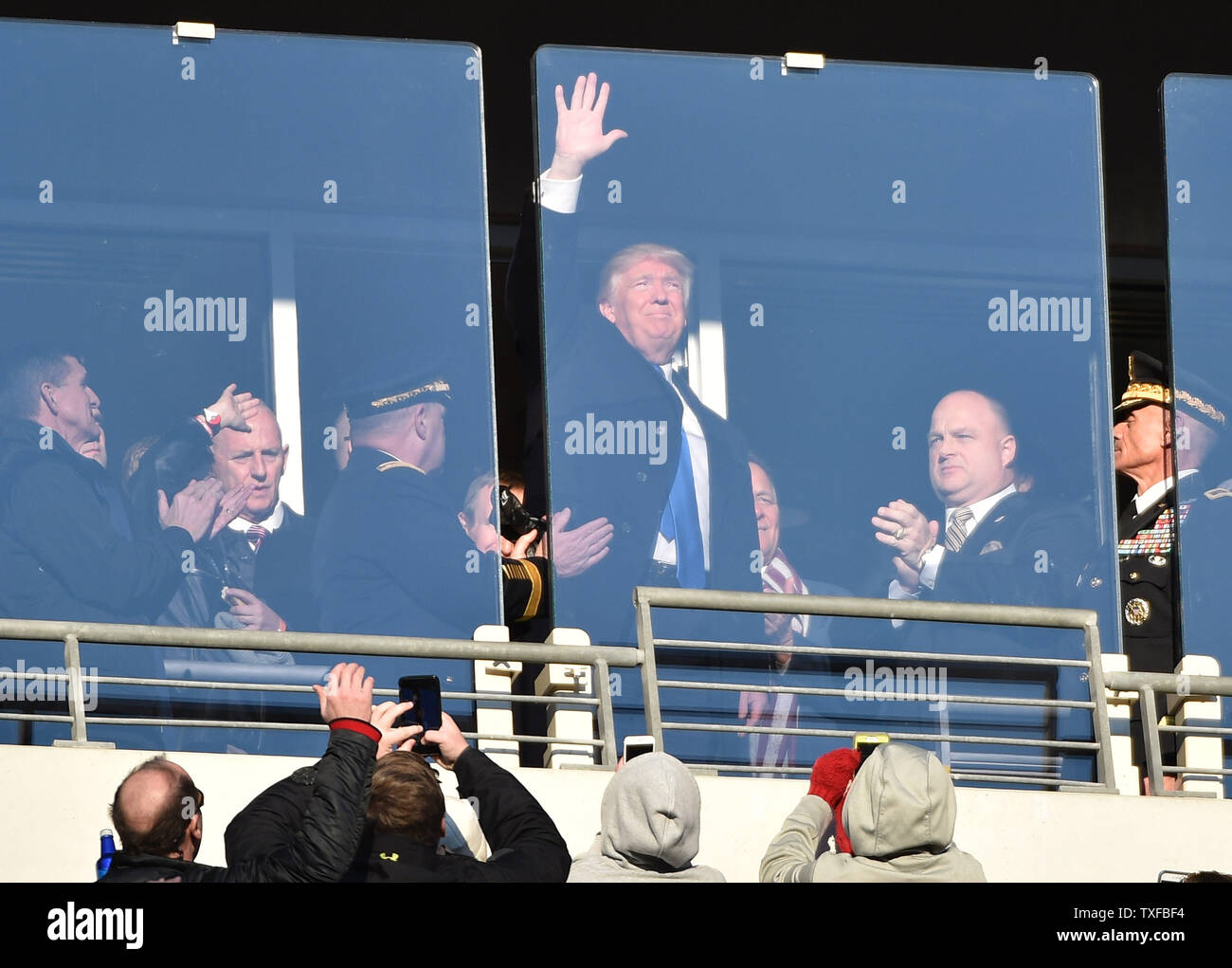 President-elect Donald Trump waves from the Navy stands during the ...