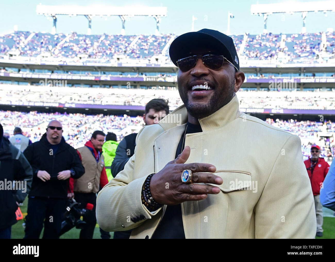 Former Baltimore Ravens linebacker Ray Lewis walks the sideline during ...