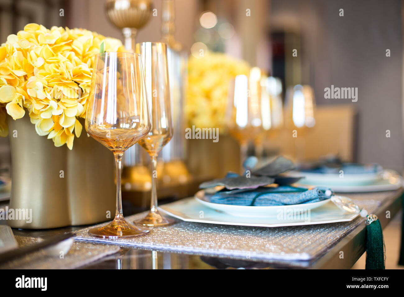 elegant crockery on dining table in modern dining room Stock Photo - Alamy