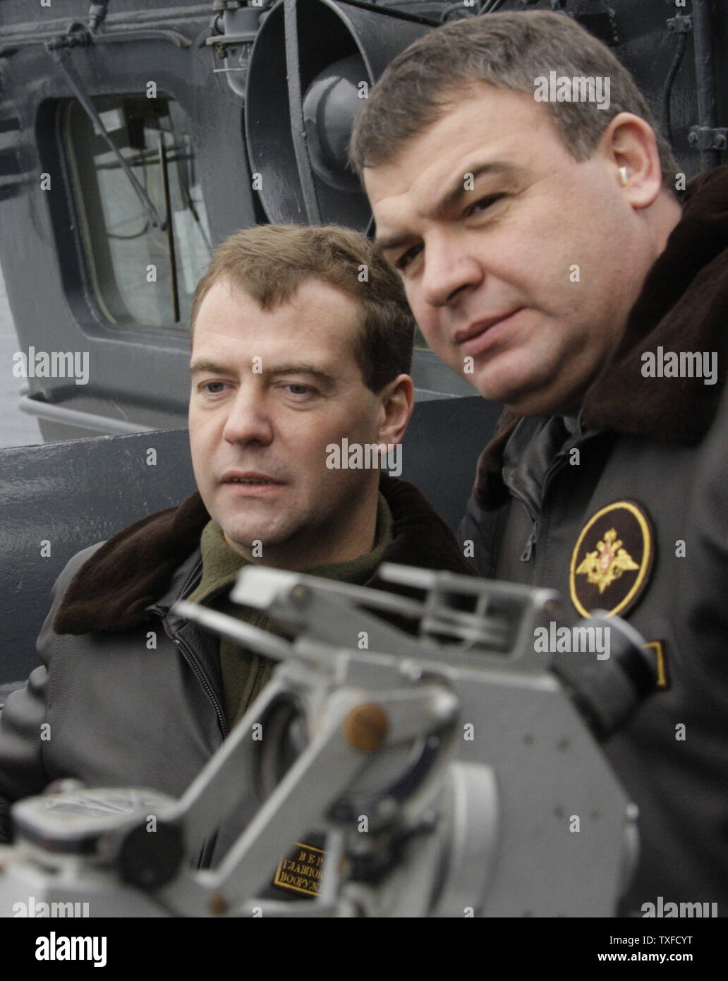Russian President Dmitry Medvedev (L) accompanied by Defense Minister ...