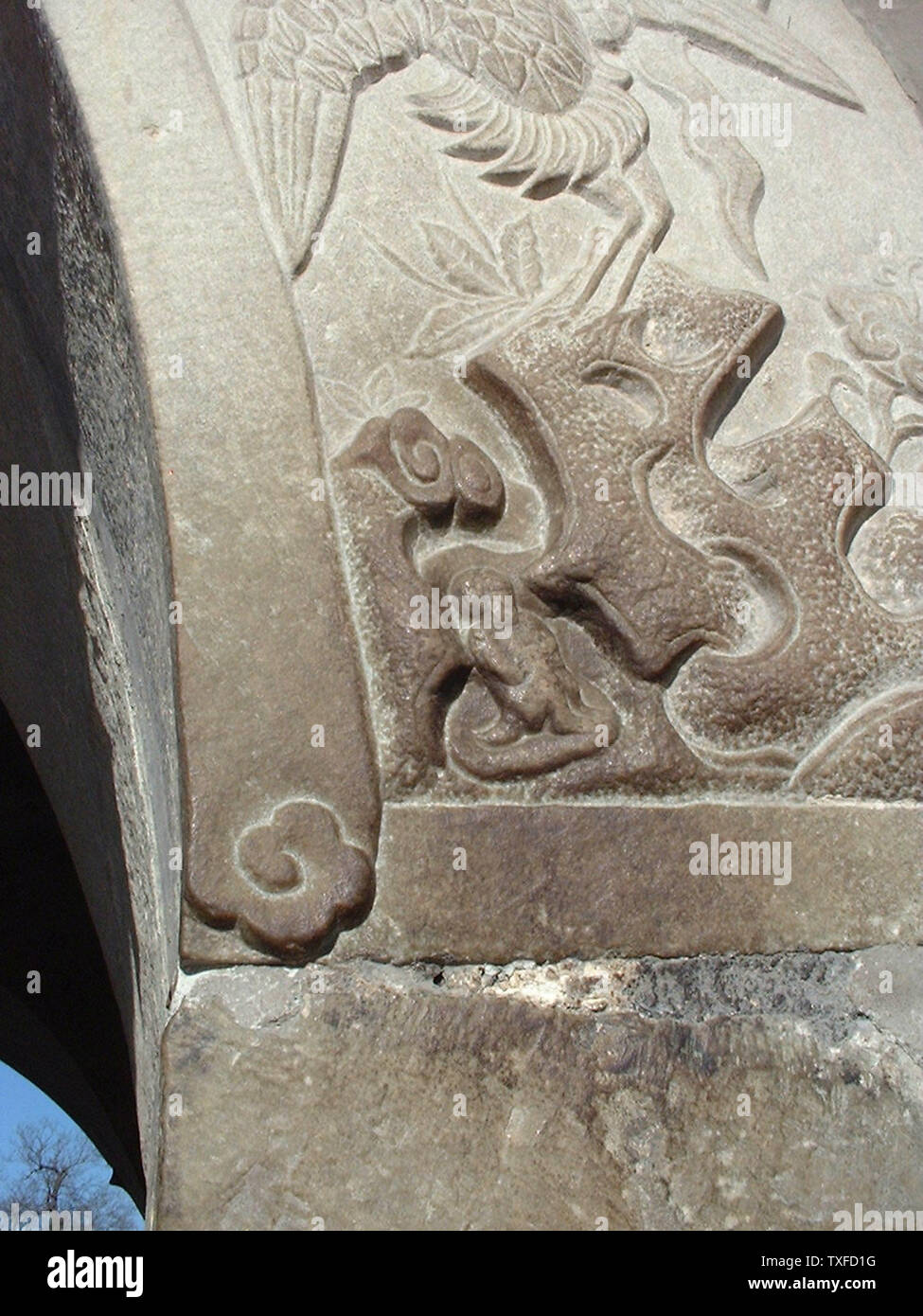 A bas-relief figure of a stone monkey at the archway leading into the ...