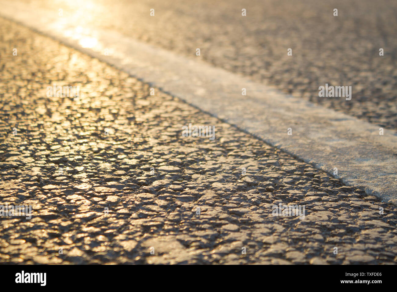 asphalt road close up on the sunset Stock Photo - Alamy