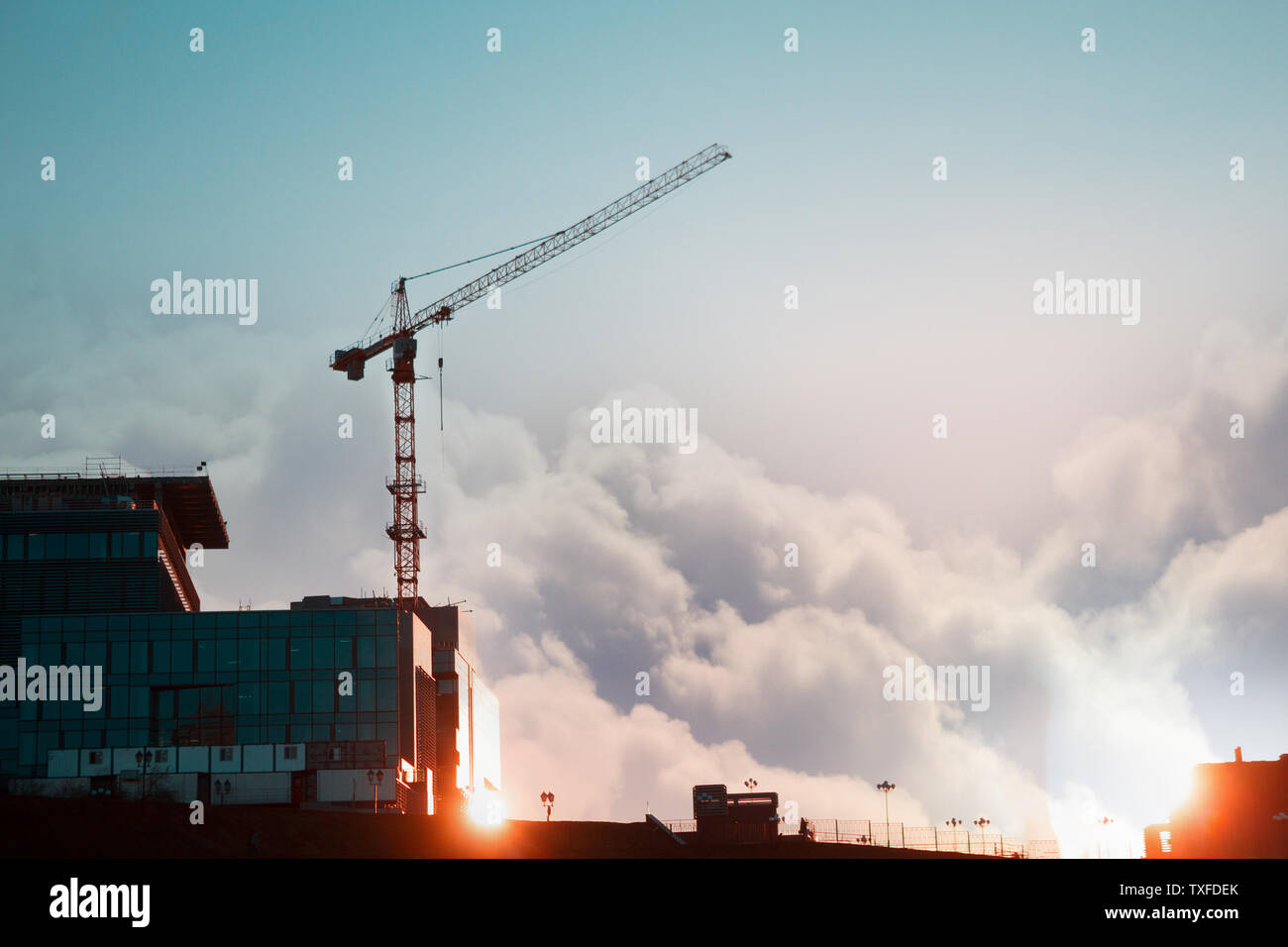 construction site over sunset sky background Stock Photo - Alamy