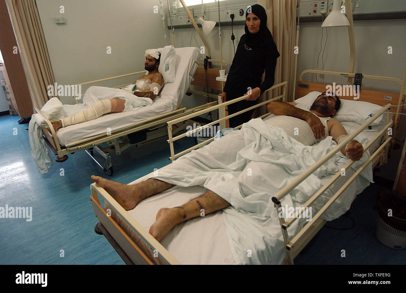 Najwa Ibrahim Salim looks after both her husband Maan Ali Said (right ...