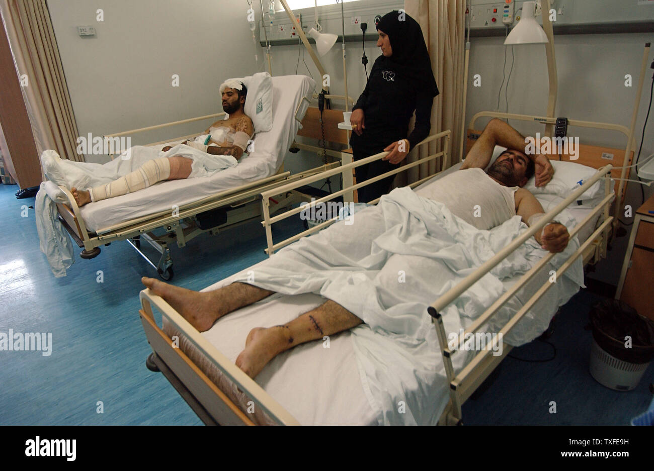 Najwa Ibrahim Salim looks after both her husband Maan Ali Said (right ...