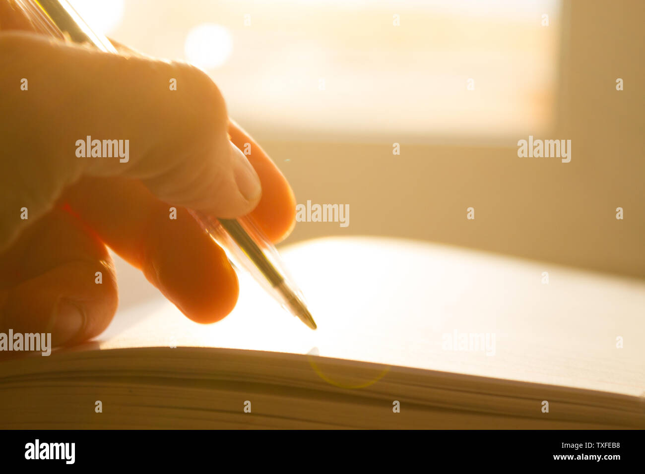 hand write something in a book. blur Stock Photo - Alamy
