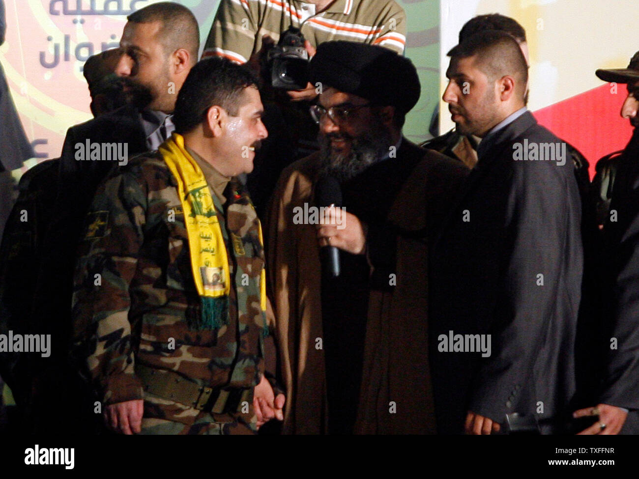 Hezbollah Leader Hassan Nasrallah (C) welcomes Samir Qantar (L) and the ...